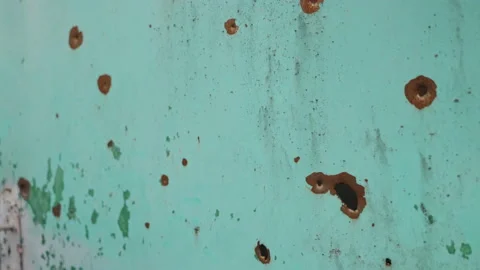 metal fence, Bullet riddled, pierced wal... | Stock Video | Pond5