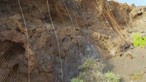 Metal mesh on cliff prevents falling roc... | Stock Video | Pond5
