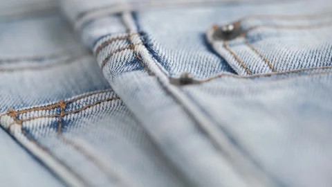 metal rivets on the pockets of denim tro... | Stock Video | Pond5