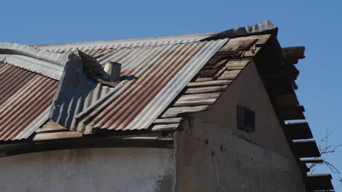 Metal roofing flapping in the wind on an... | Stock Video | Pond5