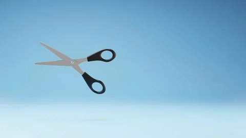 Metal Scissors Spinning on Studio Blue B... | Stock Video | Pond5