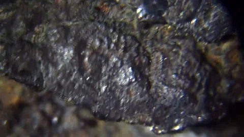 Meteorite under a microscope | Stock Video | Pond5