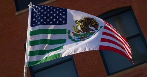 A Mexican-American hybrid flag blows in ... | Stock Video | Pond5