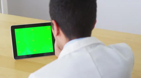 Mexican doctor talking to tablet with gr... | Stock Video | Pond5