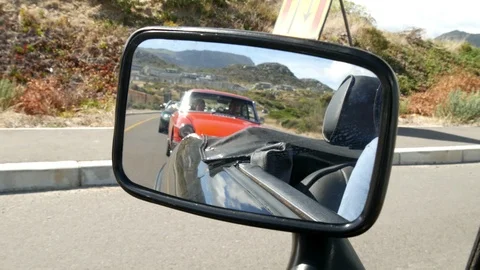 MGB rear view mirror with following red ... | Stock Video | Pond5