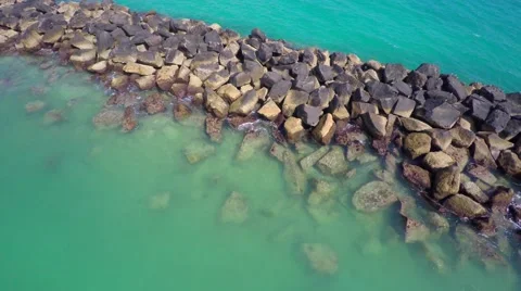Miami Beach rocks and ocean 4k | Stock Video | Pond5