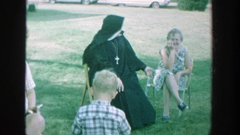 MICHIGAN-1964: Weird Nun And A Family | Stock Video | Pond5