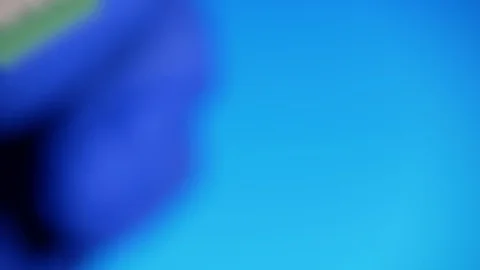 Micro sim closeup on blue background. Ce... | Stock Video | Pond5