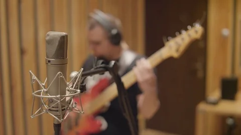 Microphone. Young Man Playing Electric B... | Stock Video | Pond5