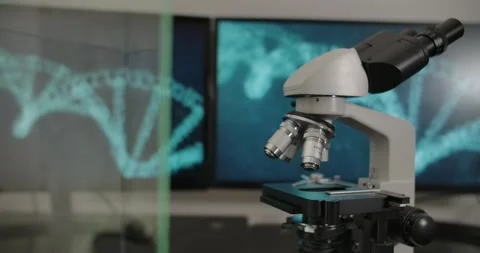 Microscope and DNA spinning in a lab | Stock Video | Pond5