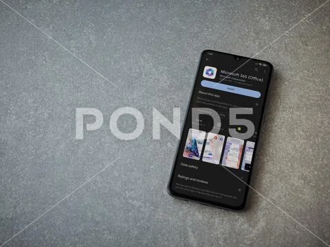 Microsoft 360 app play store page on smartphone on ceramic stone ...