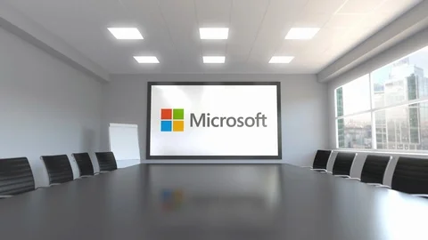 Microsoft logo on the screen in a meetin... | Stock Video | Pond5