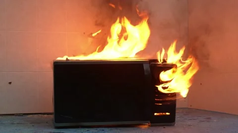 microwave oven on fire. the concept of f... | Stock Video | Pond5
