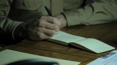 Mid-Century military man writes at desk ... | Stock Video | Pond5