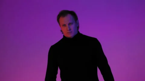 A middle-aged man approaches the camera.... | Stock Video | Pond5