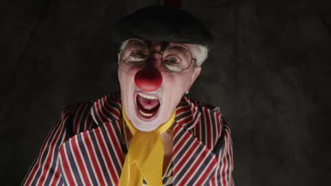 Middle-Aged Man in Clowns Outfit Making ... | Stock Video | Pond5