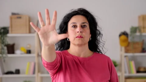 Middle aged woman doing stop sign with h... | Stock Video | Pond5