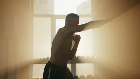 Middle shot of boxer all alone doing box... | Stock Video | Pond5
