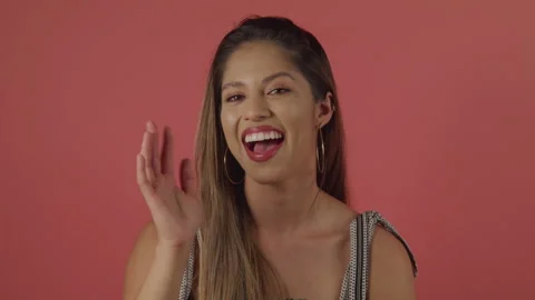 Middle shot of Woman Waves Hello standin... | Stock Video | Pond5