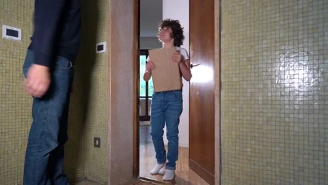 Milan 2023 -Boy child 8 years open door ... | Stock Video | Pond5