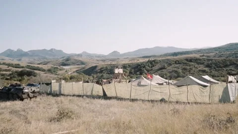 a military camp in the desert. tents and... | Stock Video | Pond5