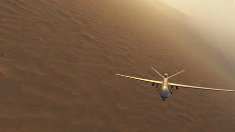 Military drone (UAV) flying over desert | Stock Video | Pond5