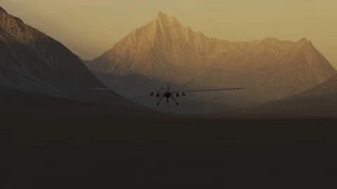 Military drone (UAV) flying over desert | Stock Video | Pond5