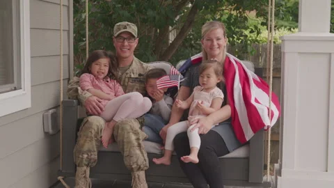 Military Family Sitting on the Front Por... | Stock Video | Pond5