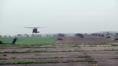 Military helicopters parked on an open g... | Stock Video | Pond5