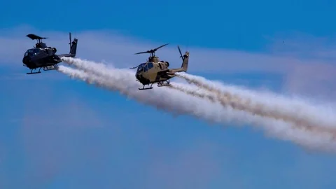 Military helicopters with smoke trails c... | Stock Video | Pond5