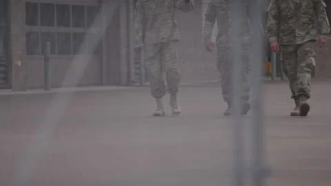 Military Members Behind a Gate Walking a... | Stock Video | Pond5