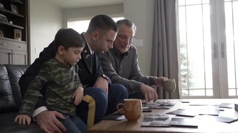 Military multi-generation men looking at... | Stock Video | Pond5