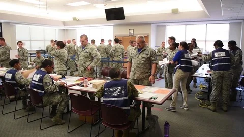 Military staff processing airman for dep... | Stock Video | Pond5