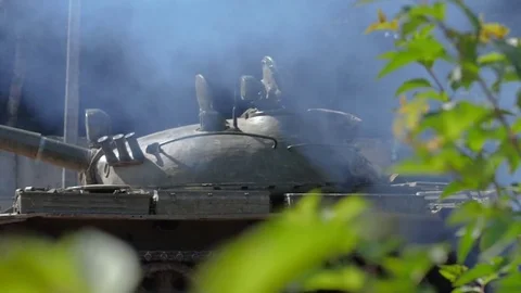 Military tank on smoke background standi... | Stock Video | Pond5