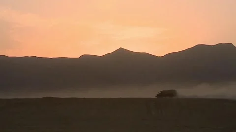 Military truck moving through the desert... | Stock Video | Pond5