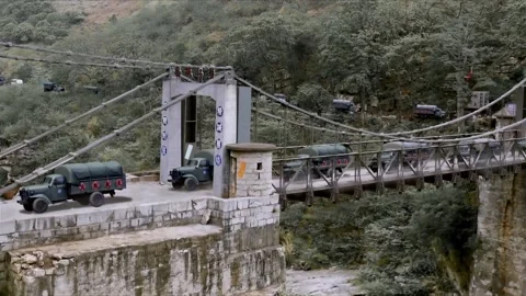 Military truck passing bridge | Stock Video | Pond5