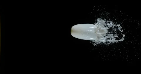 Milk Exploding and Splashing on Black Ba... | Stock Video | Pond5