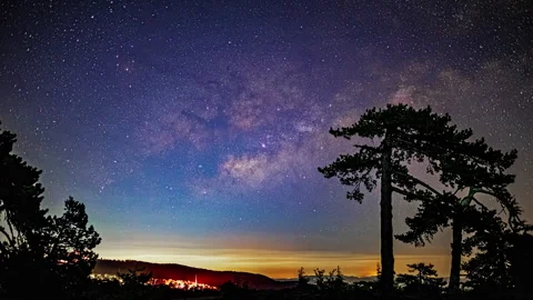 Milky Way band descends below clouds, ni... | Stock Video | Pond5