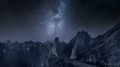 Milky way over mountain path to Tre Cime... | Stock Video | Pond5
