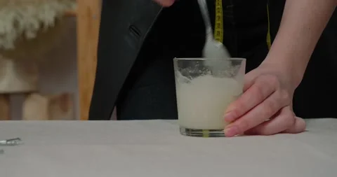 Milliner prepares glue for fixing shape ... | Stock Video | Pond5