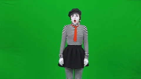 Mime girl acting like it's cold, then ho... | Stock Video | Pond5