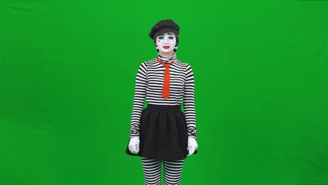 Mime girl is inflating a balloon. Green ... | Stock Video | Pond5
