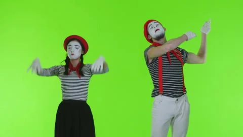 Mimes play musical instruments on a tran... | Stock Video | Pond5