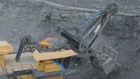 Mine excavator loading coal into dump tr... | Stock Video | Pond5