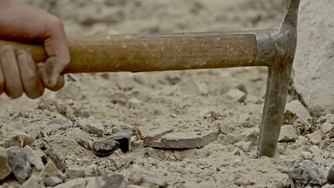 Miner or gold digger breaking rock by di... | Stock Video | Pond5