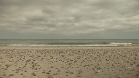 A minimalistic beach scene with sand ful... | Stock Video | Pond5