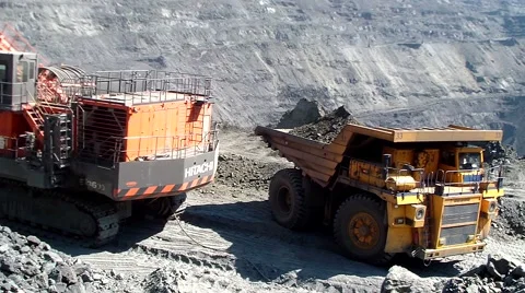 Mining dump trucks in the open pit mine | Stock Video | Pond5