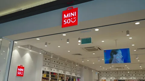 Miniso store logo signboard above the en... | Stock Video | Pond5