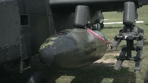 Missle bomb on Apache attack helicopter ... | Stock Video | Pond5