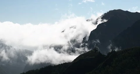 Mist shrowded peaks from Encumeada on Ma... | Stock Video | Pond5